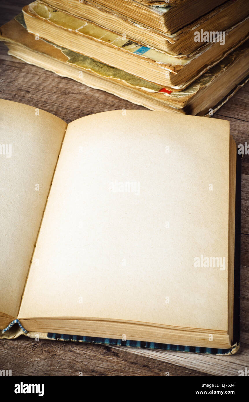 open old book on a wooden surface Stock Photo - Alamy