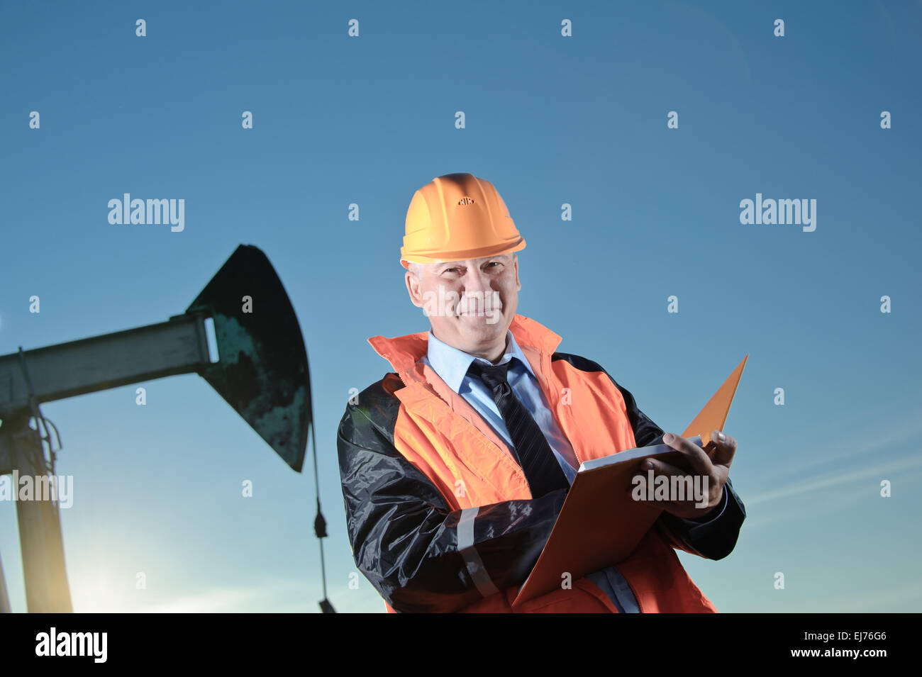 Engineer in an oil field Stock Photo - Alamy