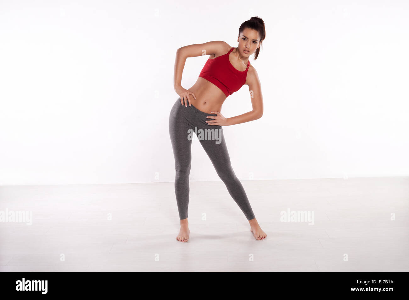 Sporty woman doing stretching exercises Stock Photo - Alamy