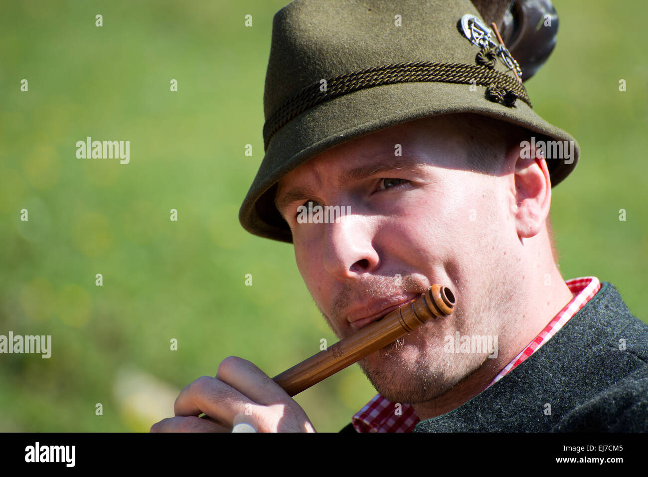 Man playing cross flute at Pfeifertag, Austria, Styria, Salzkammergut ...