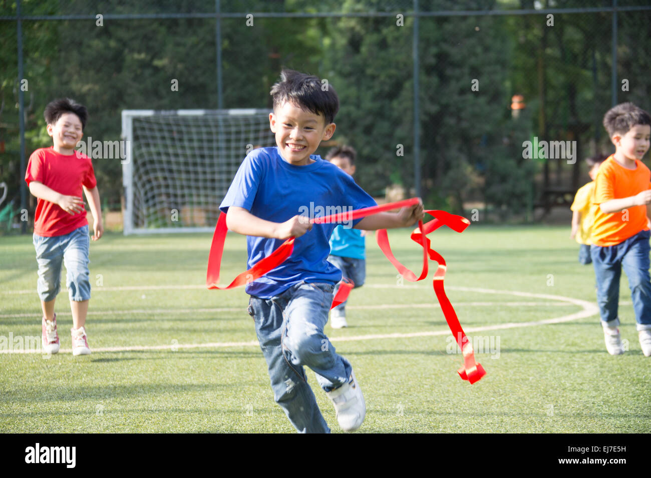 The boy won the race victory Stock Photo - Alamy