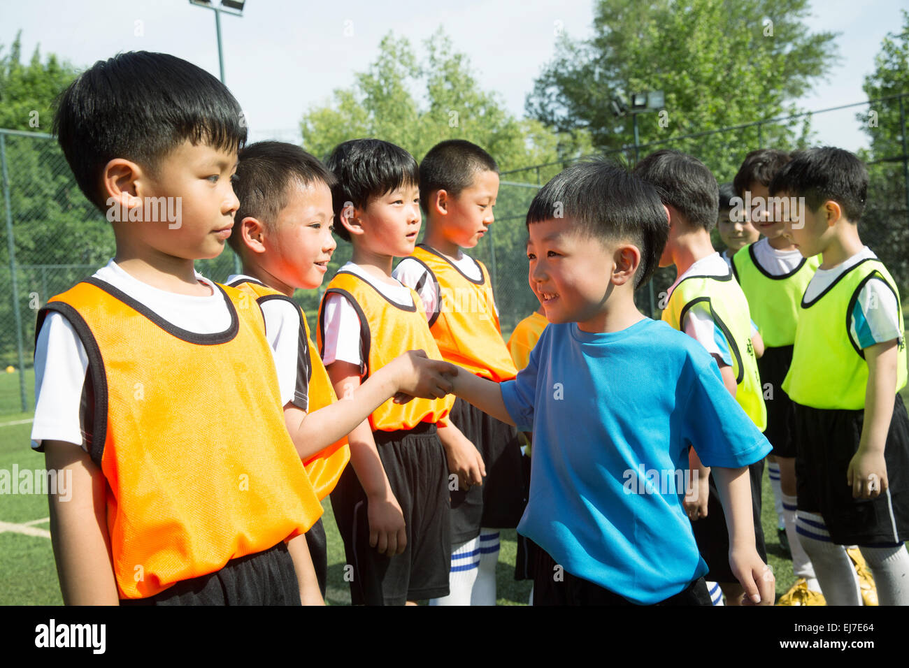 Children soccer ball handshake hi-res stock photography and images - Alamy