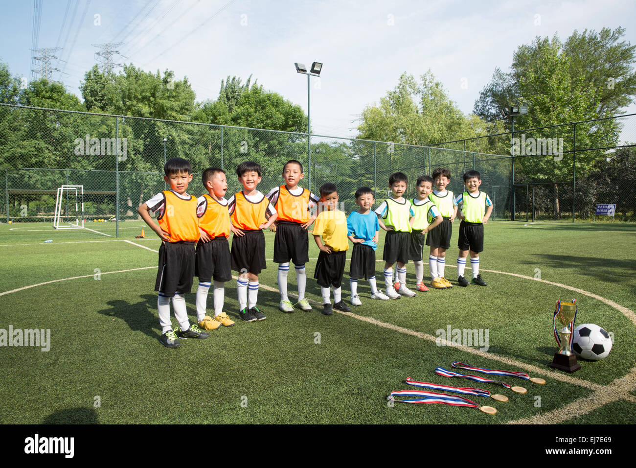 The boys her hands rested on her hips stand on the football field Stock ...