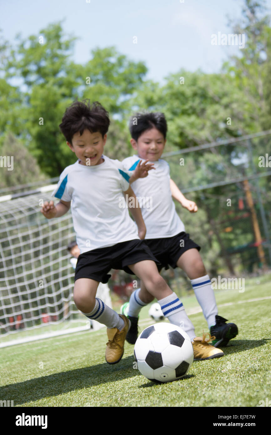 Two boys playing football on hi-res stock photography and images - Alamy
