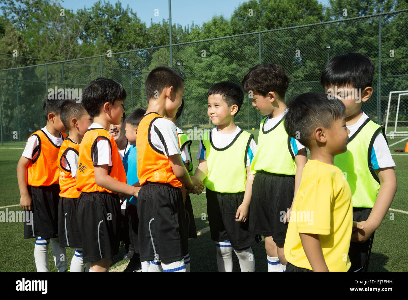 Children soccer ball handshake hi-res stock photography and images - Alamy