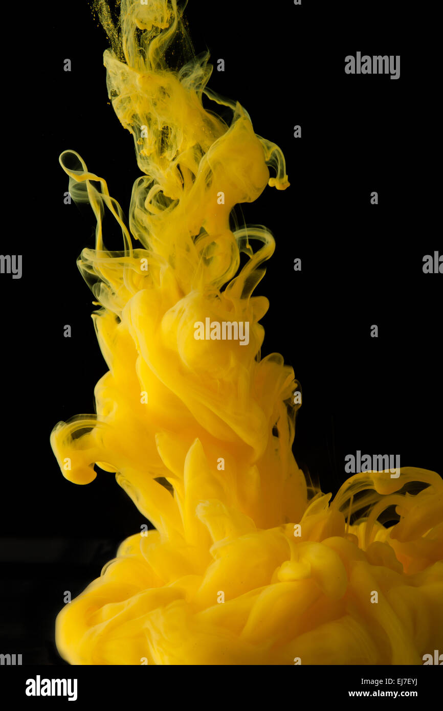 Yellow ink in the water Stock Photo - Alamy