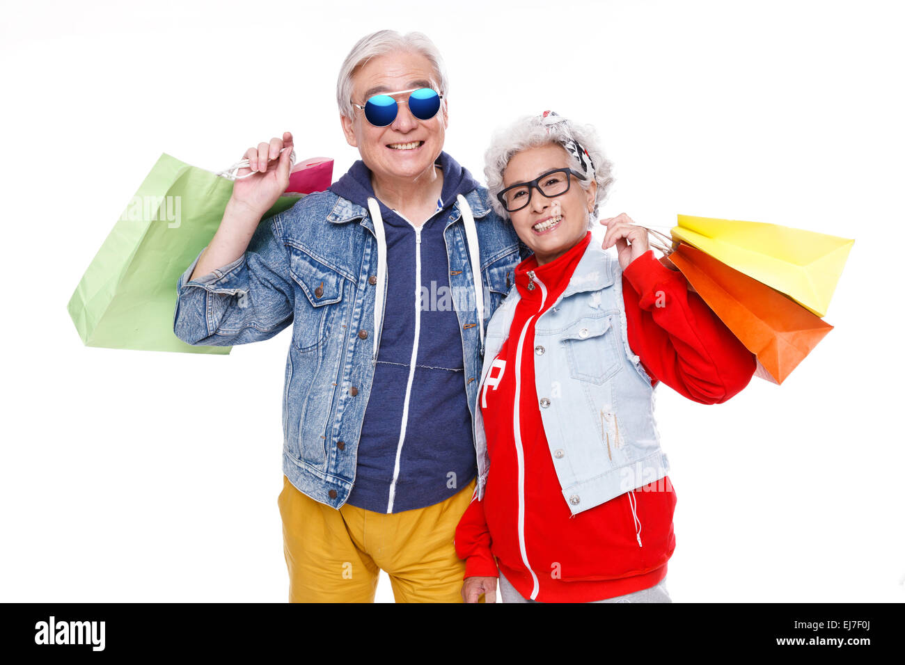 The fashion of the elderly couple with shopping bags Stock Photo - Alamy