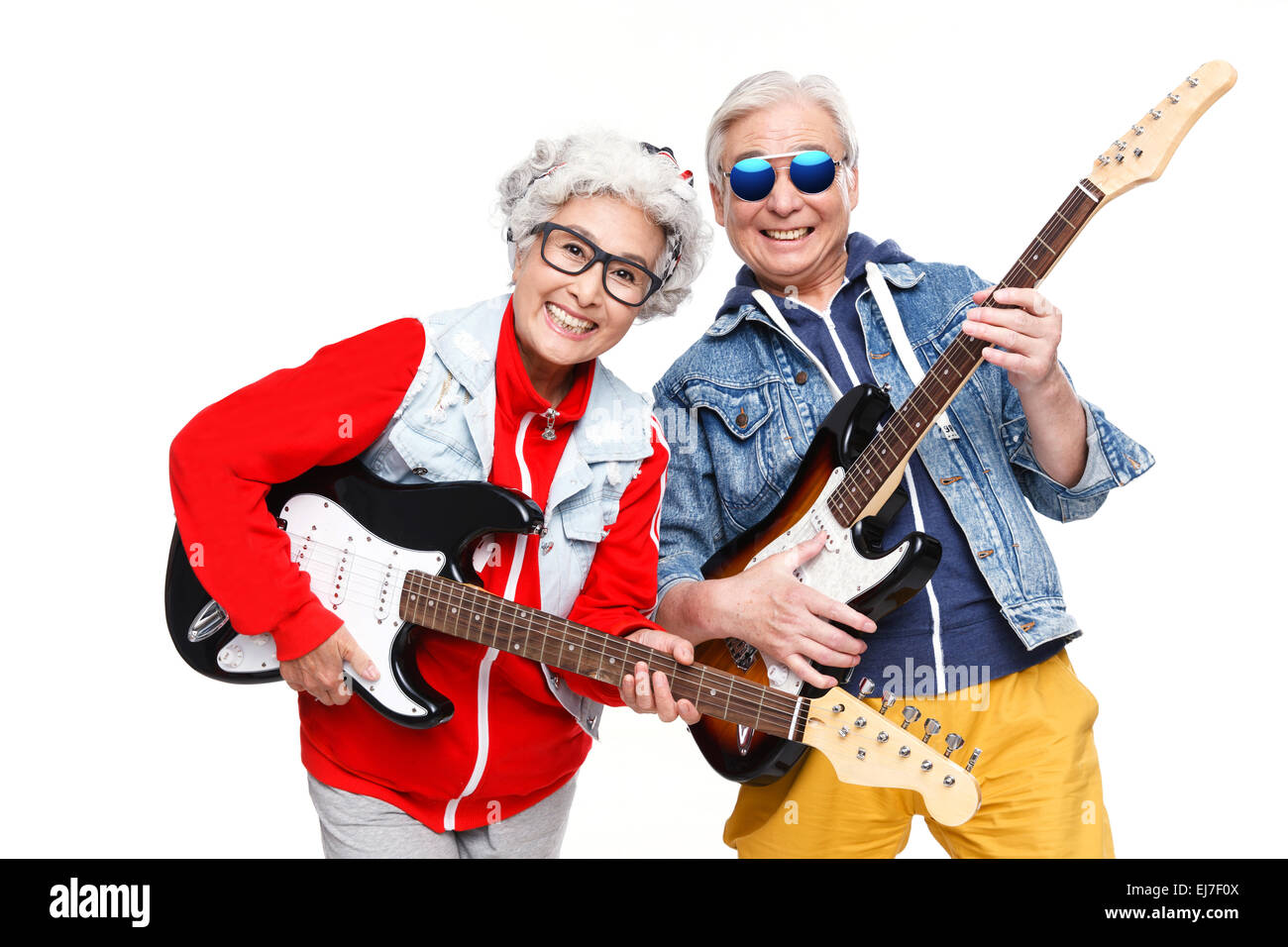 Two fashion of elderly people playing the guitar Stock Photo - Alamy