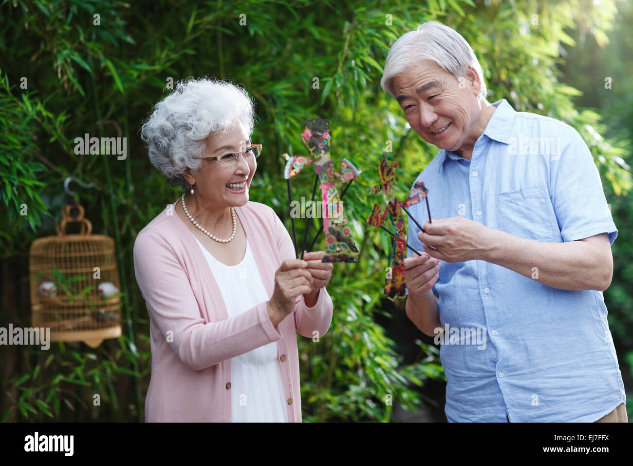 The old couple took the shadow puppet Stock Photo - Alamy
