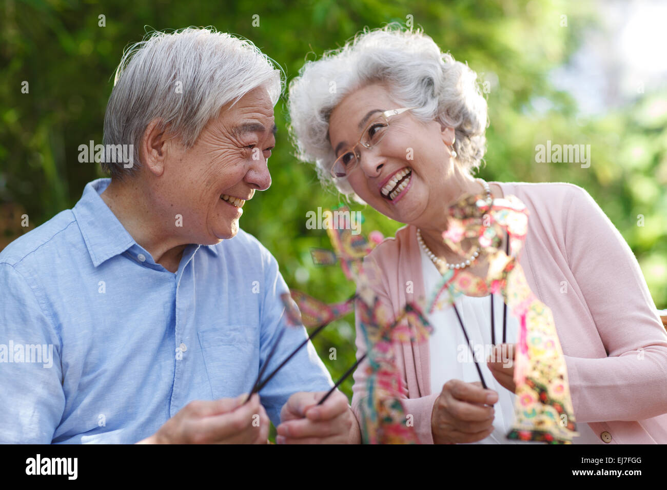 The old couple took the shadow puppet Stock Photo - Alamy