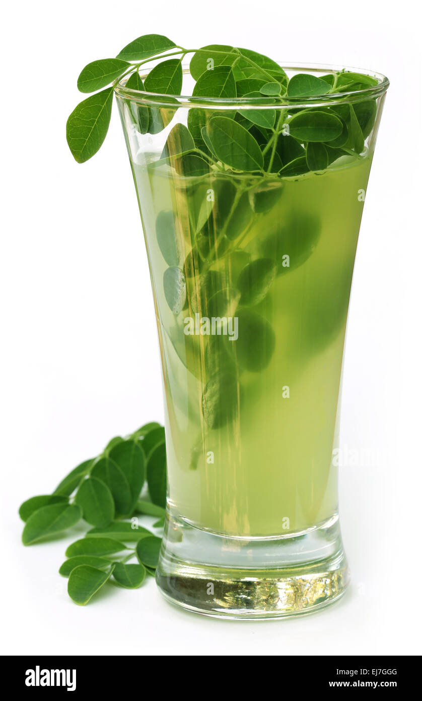 Ayurvedic Juice made from moringa leaves over white background Stock ...