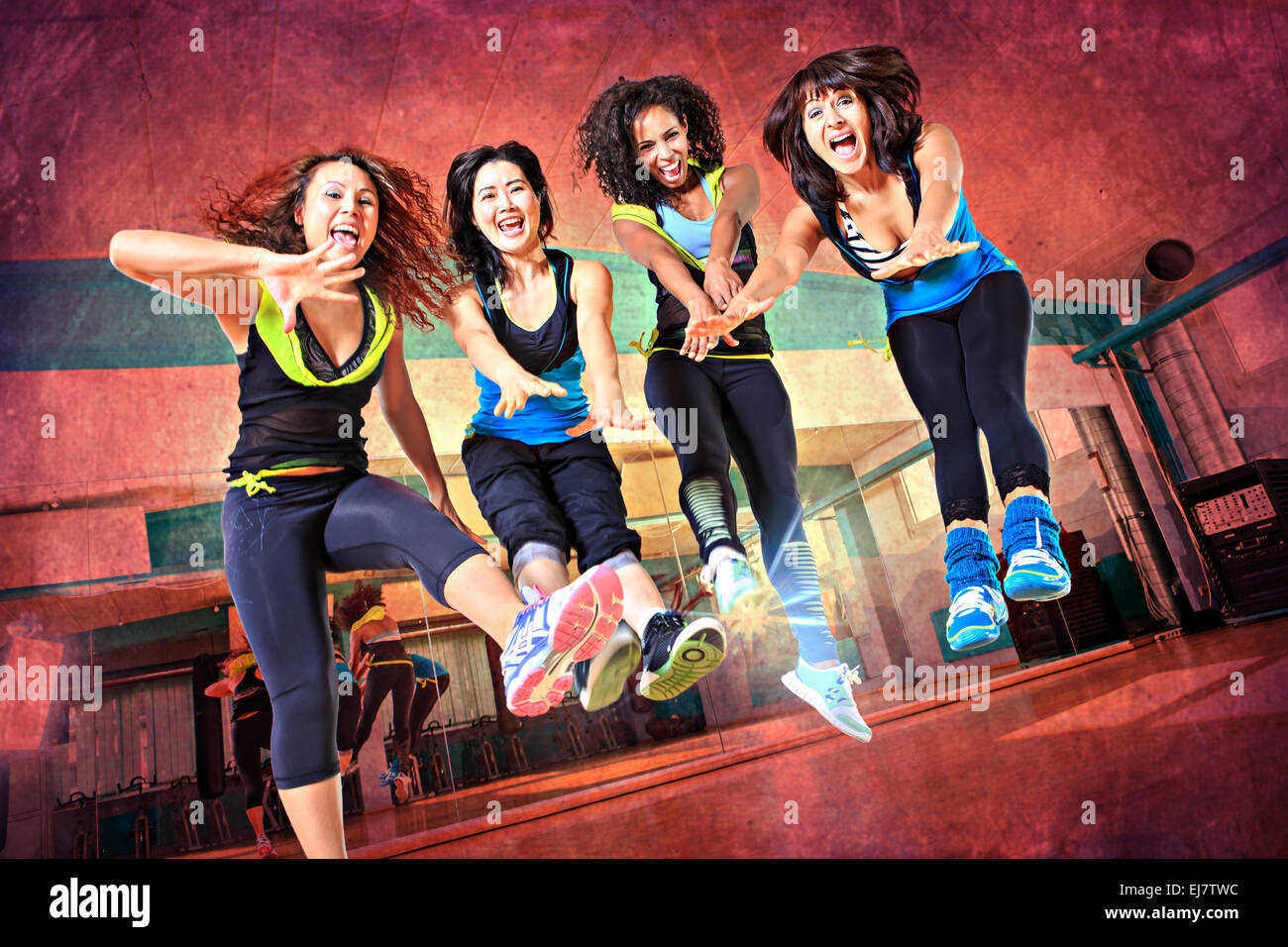 group of women in sport dress jumping at fitness dance excercise or ...