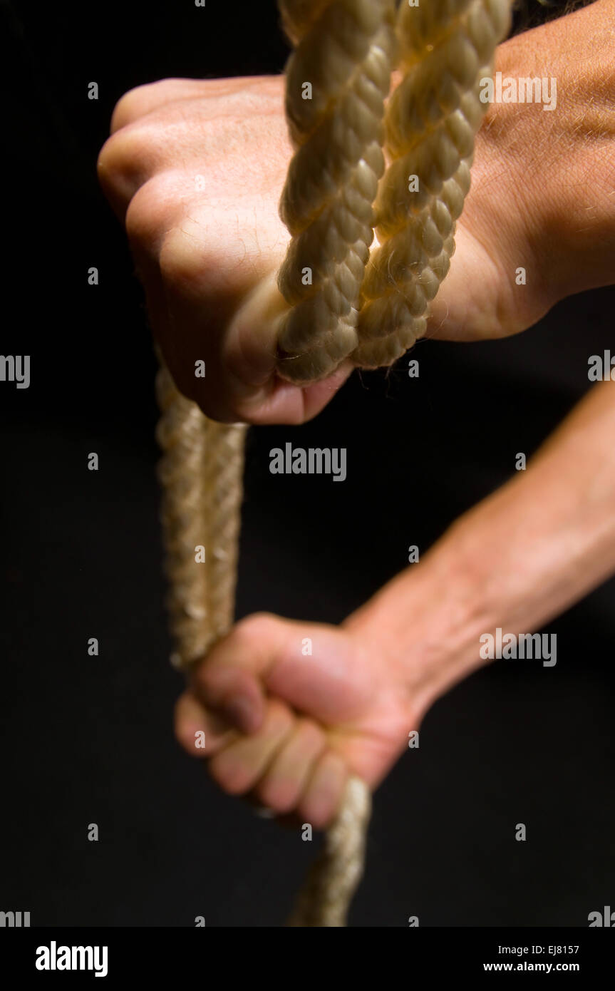 hands and rope Stock Photo - Alamy