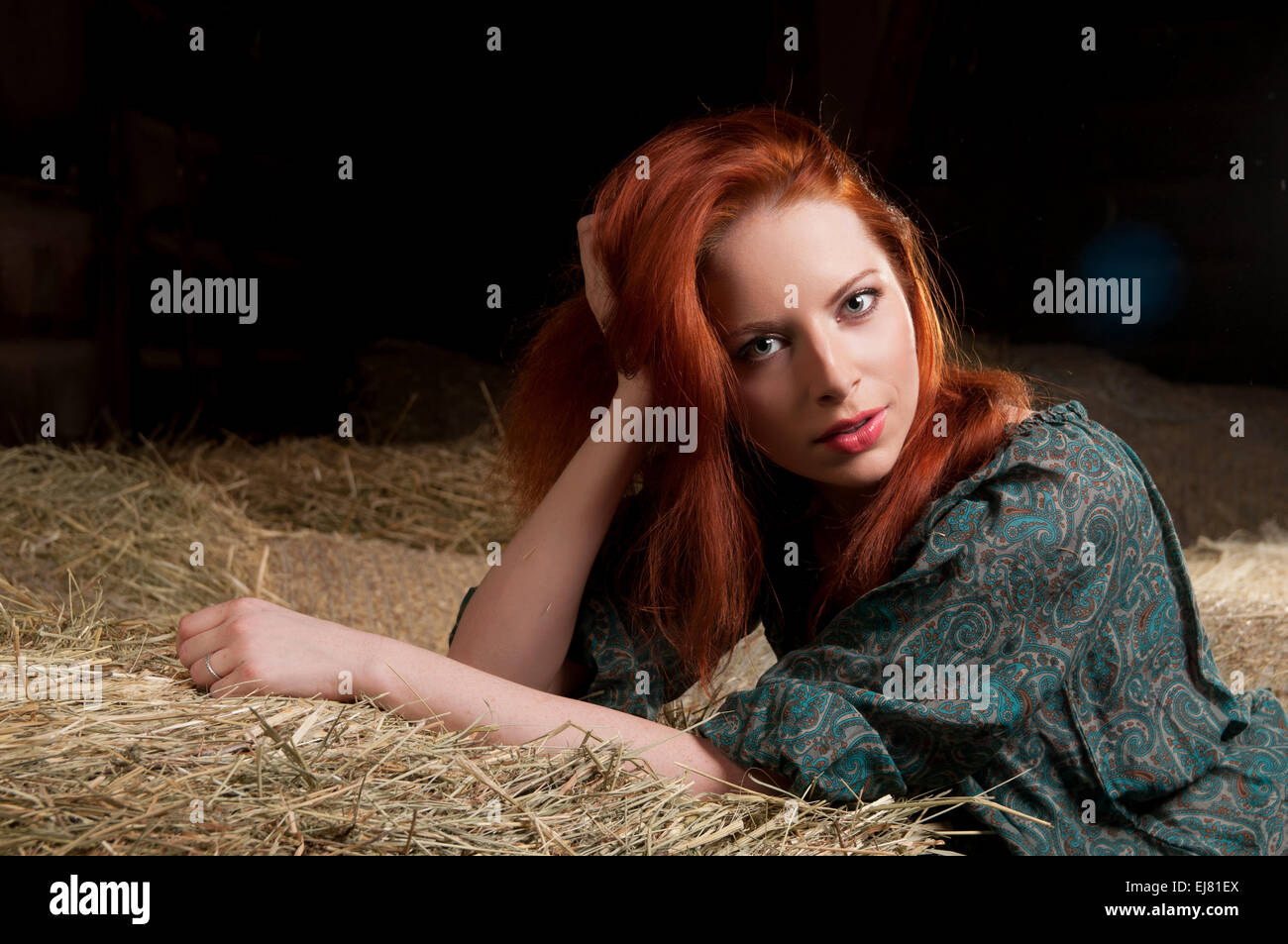 woman lying on a haystack Stock Photo - Alamy
