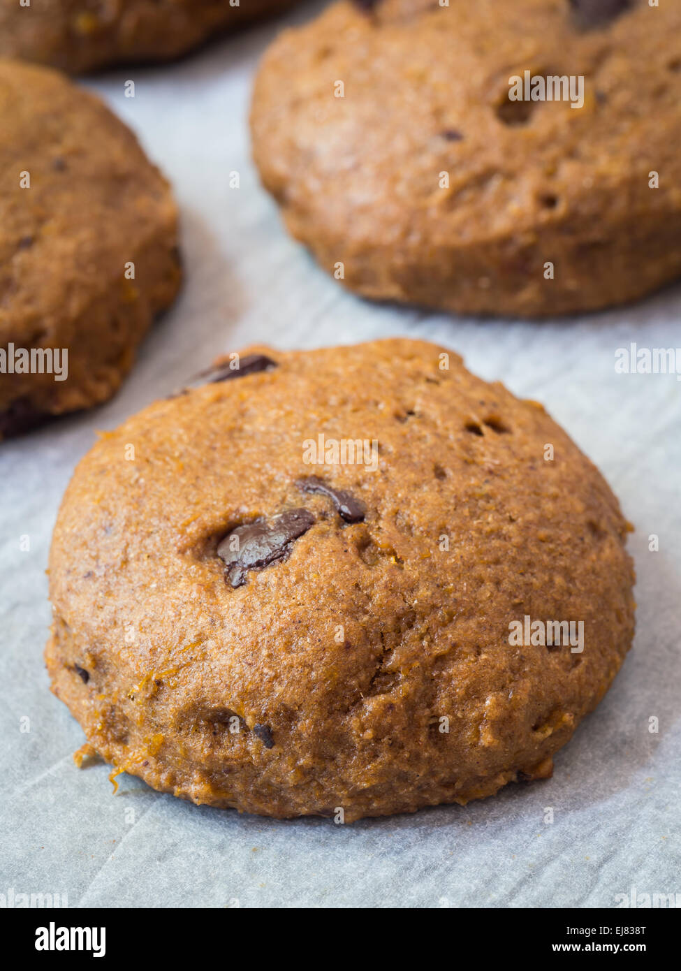 Vertical photo of whole grain vegan soft spelt pumpkin cookies with ...