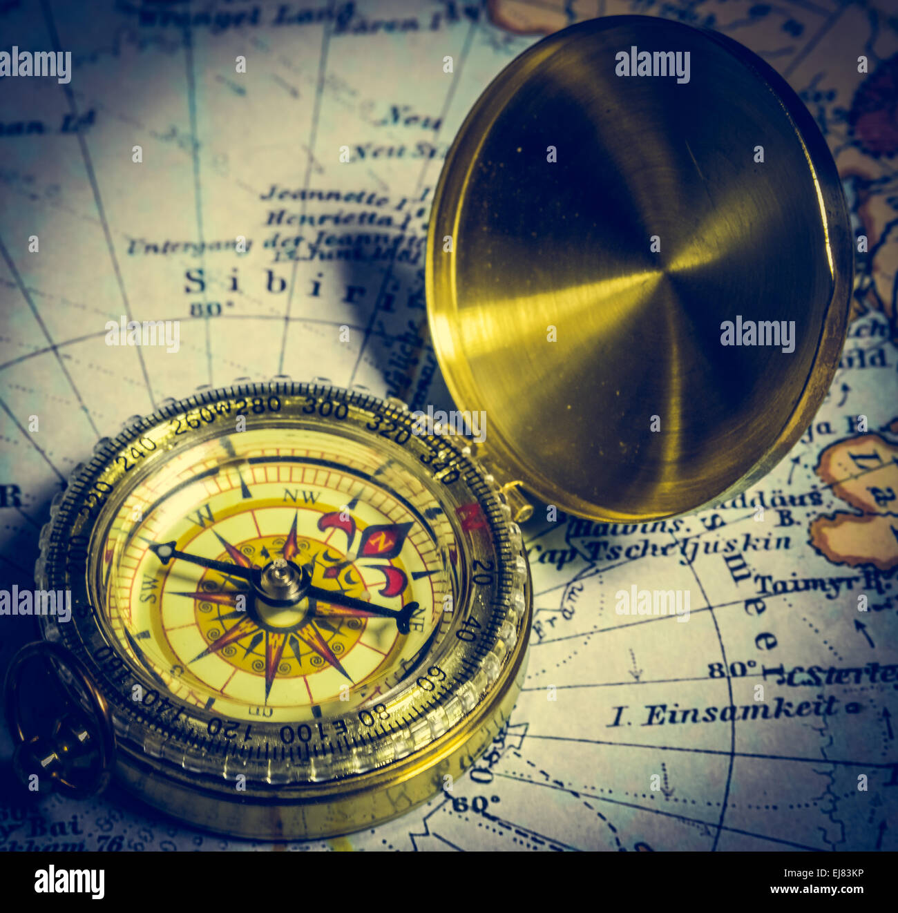 compass and magnifying glass Stock Photo - Alamy