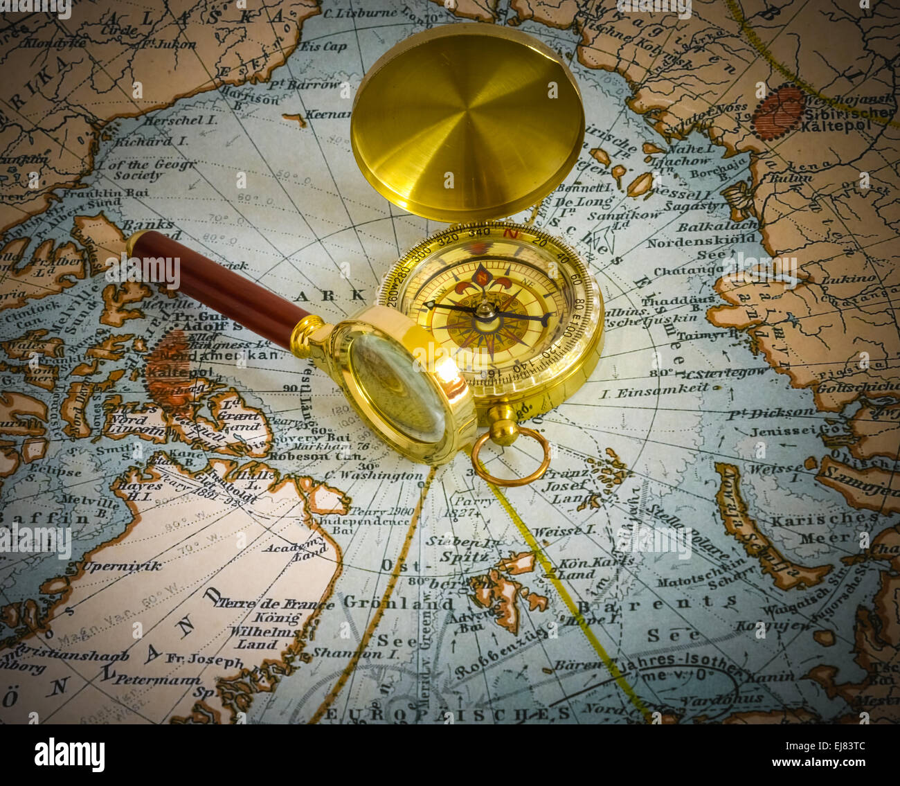 compass and magnifying glass Stock Photo - Alamy
