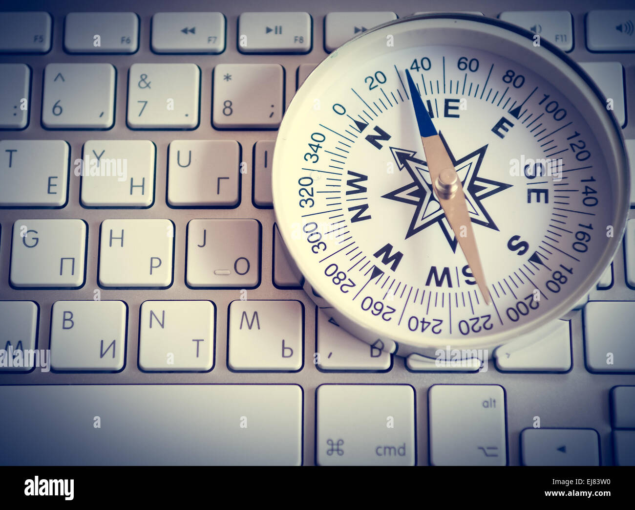 Compass on a card Stock Photo - Alamy