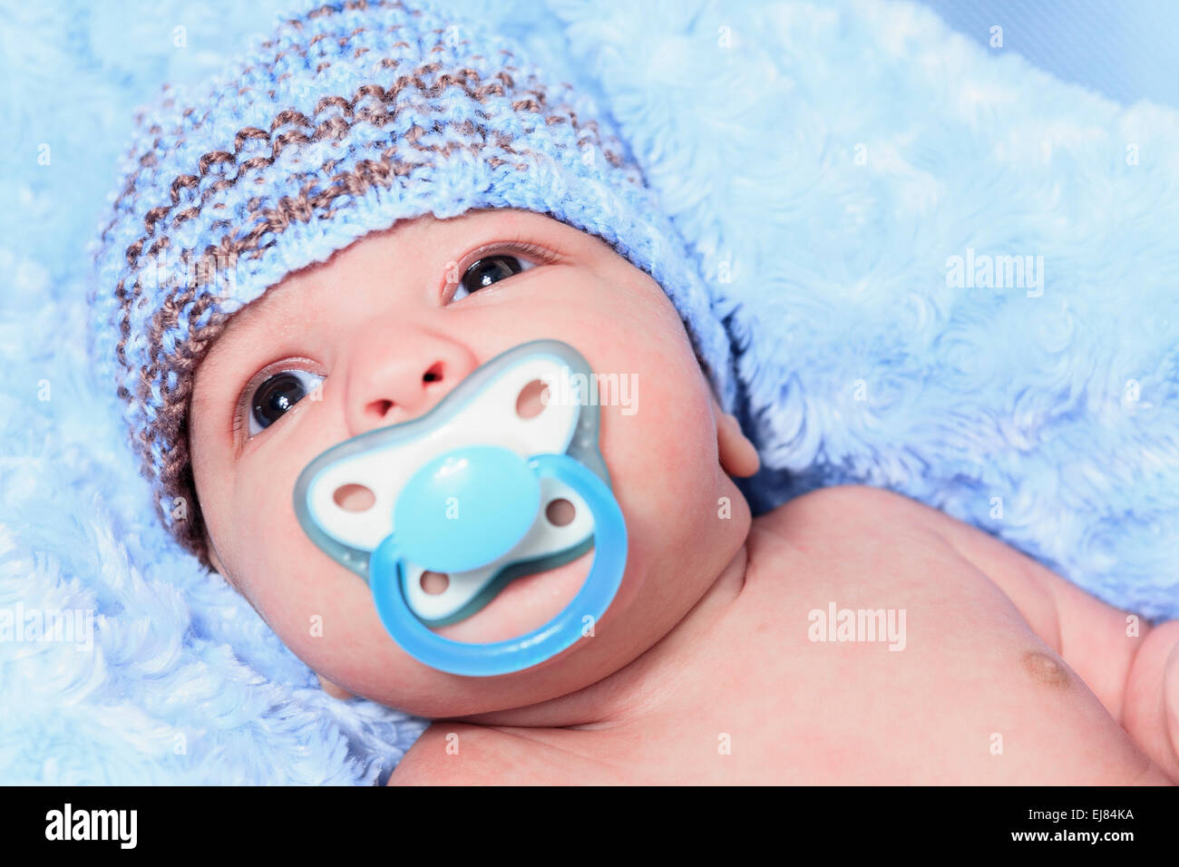 newborn baby boy wearing a blue Stock Photo - Alamy