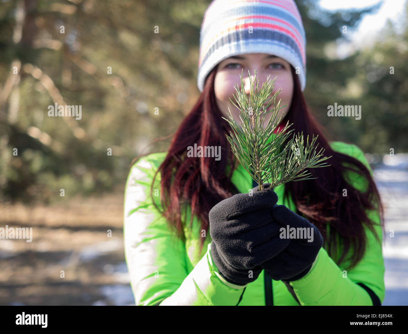 young woman holding pine branch Stock Photo - Alamy