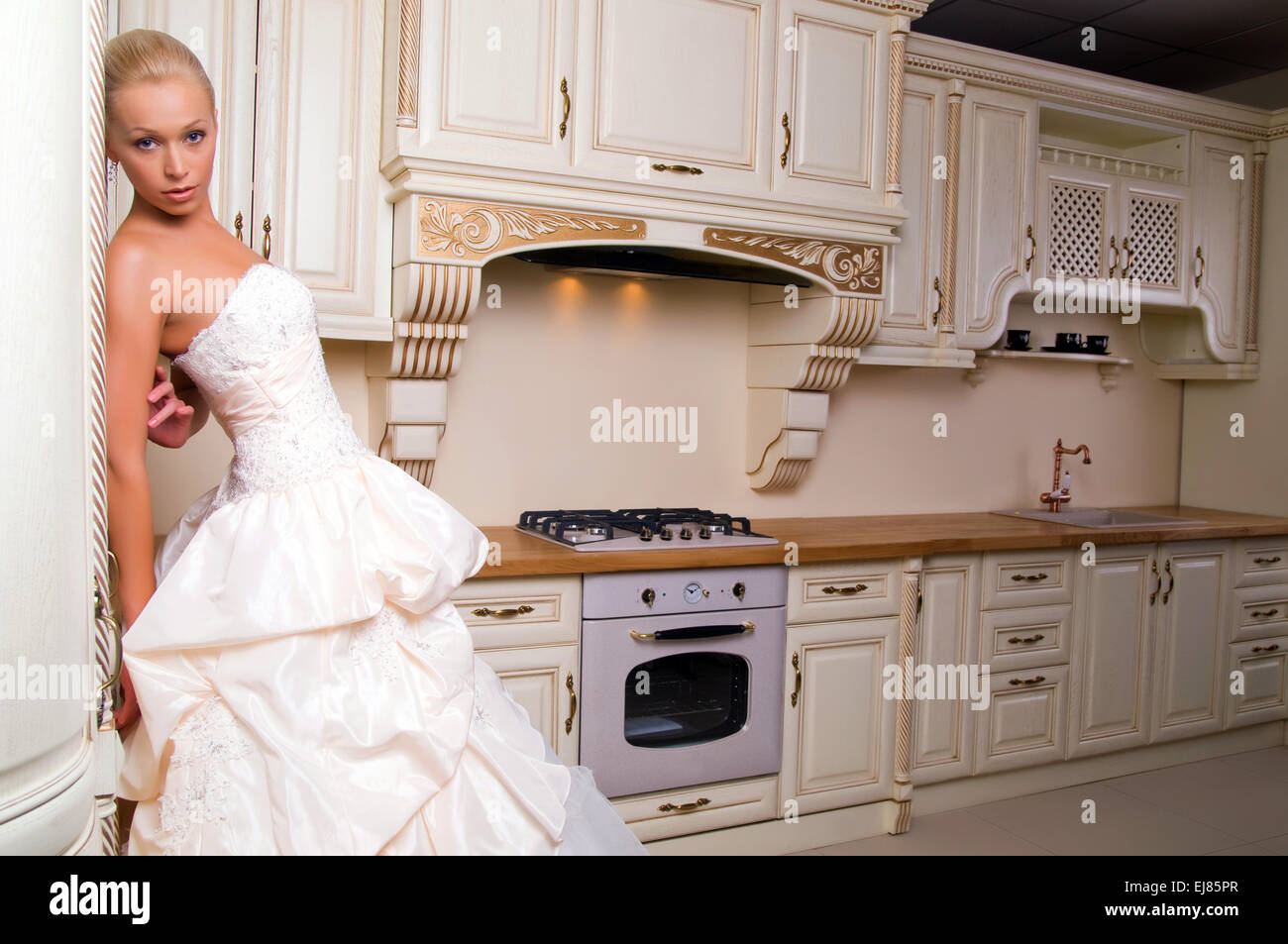 bride stands in the kitchen Stock Photo - Alamy