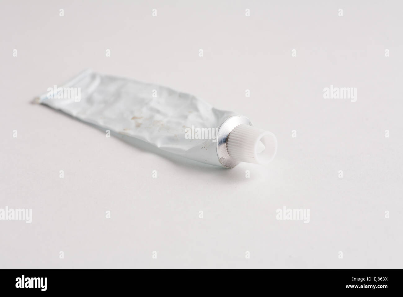 Empty tube of glue Stock Photo - Alamy