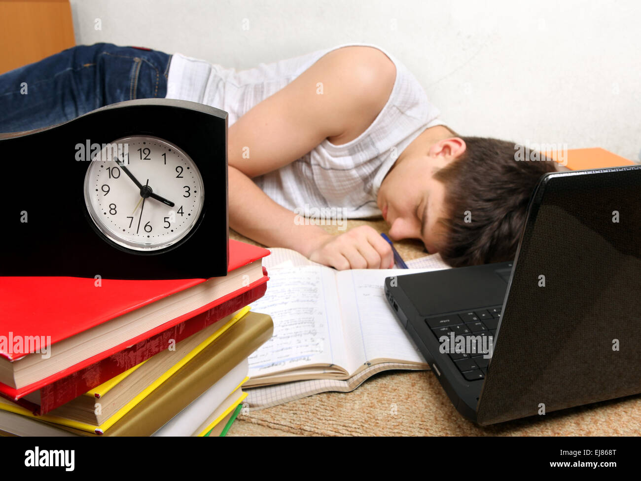 Teenager sleeps after Learning Stock Photo - Alamy