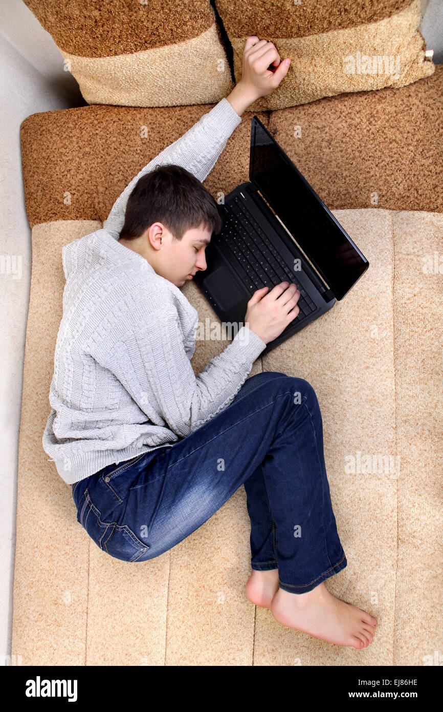 Guy sleeping on laptop hi-res stock photography and images - Alamy