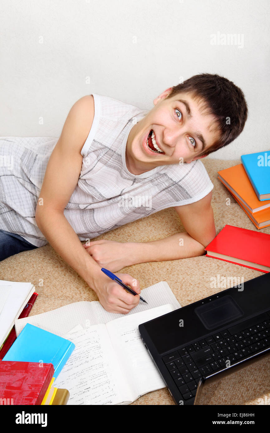 Cheerful Teenager doing Homework Stock Photo - Alamy
