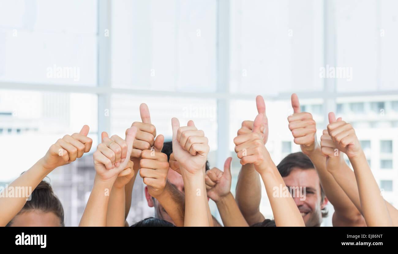Closeup of cropped people gesturing thumbs up Stock Photo - Alamy