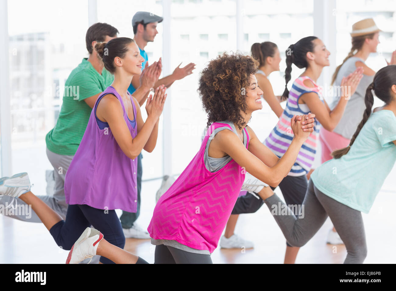 Fitness class and instructor doing pilates exercise Stock Photo - Alamy