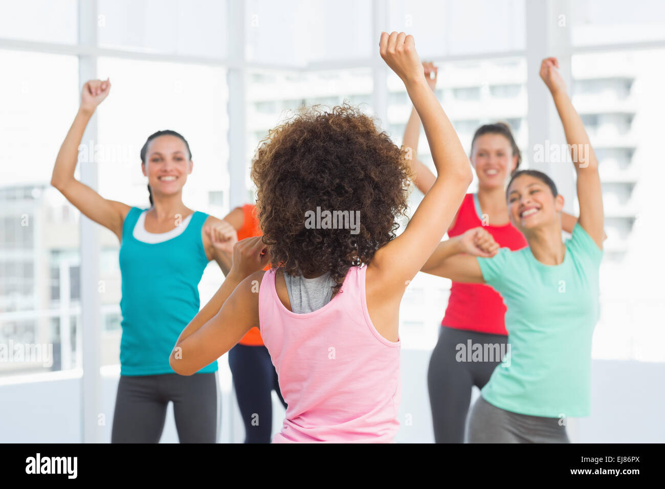 Fitness class and instructor doing pilates exercise Stock Photo - Alamy