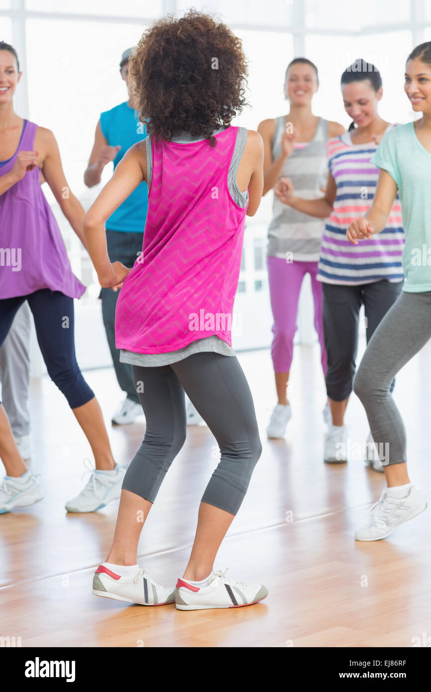 Fitness class and instructor doing pilates exercise Stock Photo - Alamy