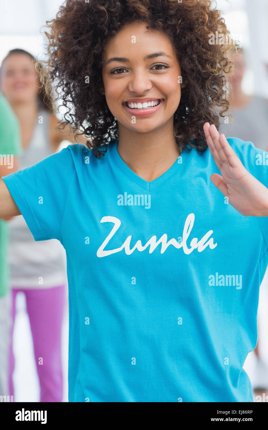 Cheerful female instructor doing pilates exercise Stock Photo - Alamy