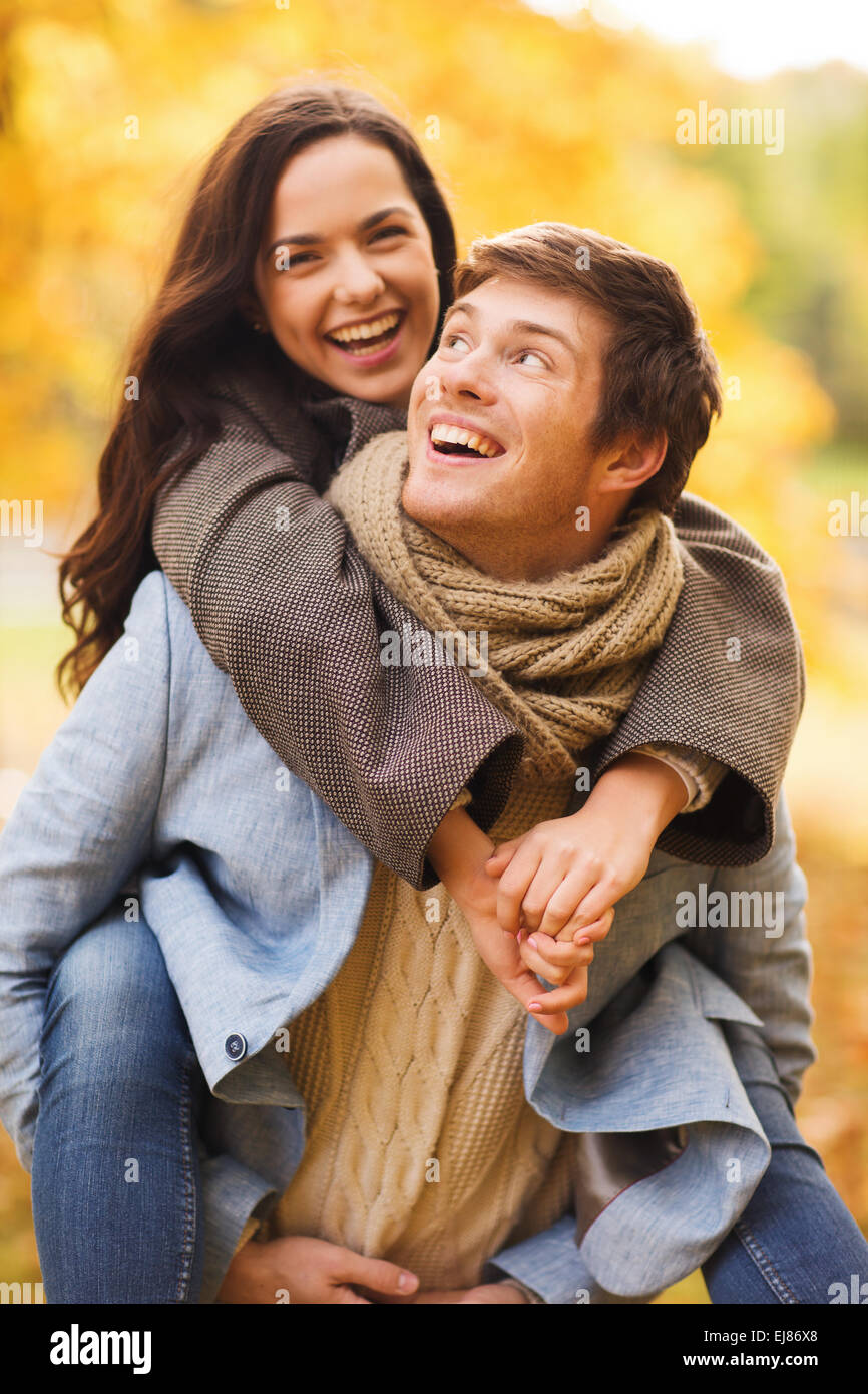 smiling couple hugging in autumn park Stock Photo - Alamy