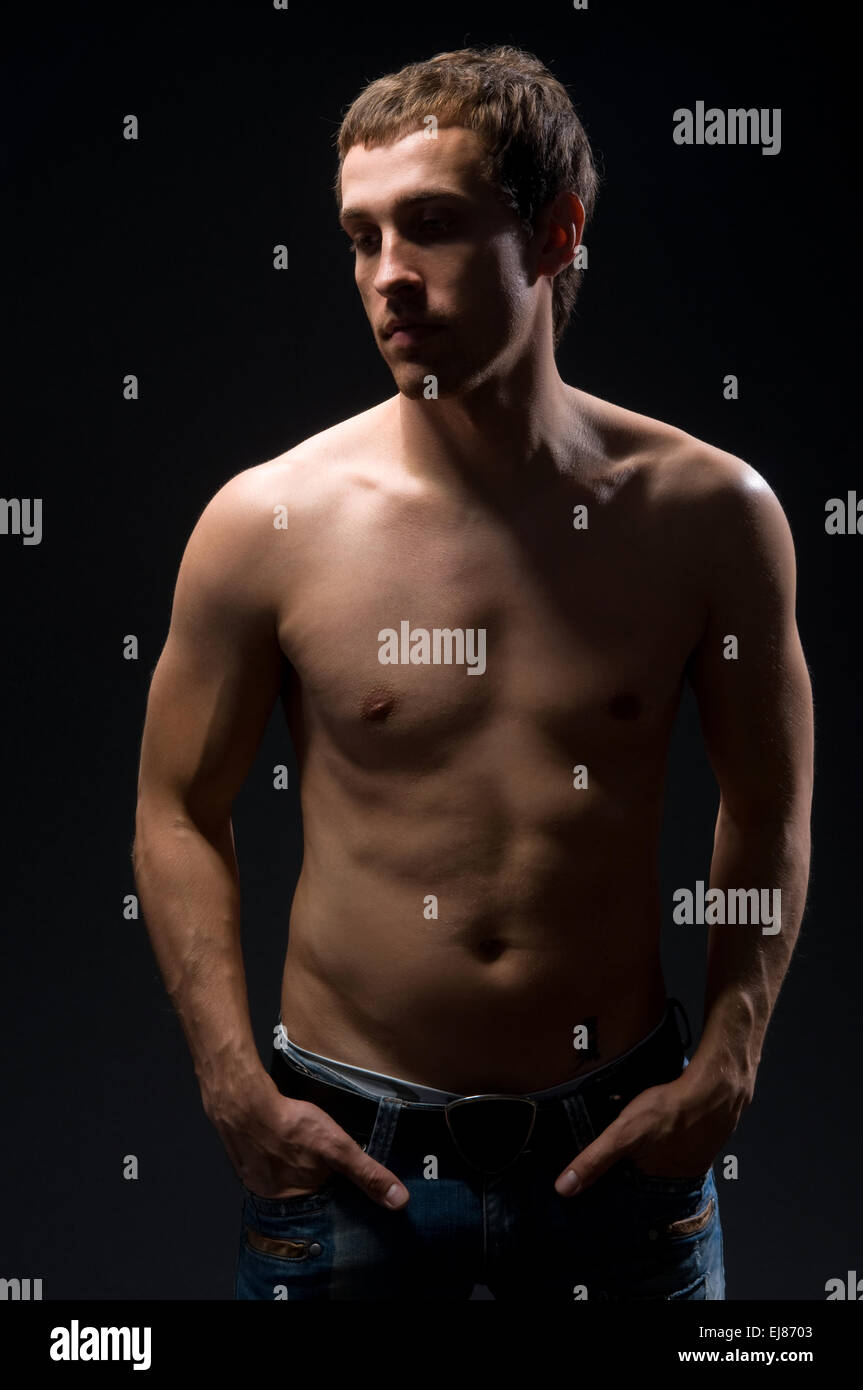 man standing near a wall Stock Photo - Alamy