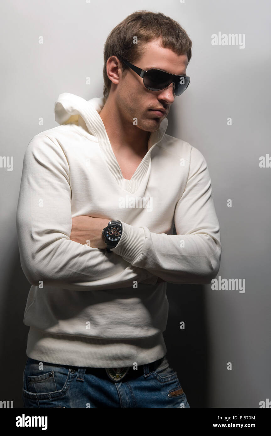 man standing near a wall Stock Photo - Alamy