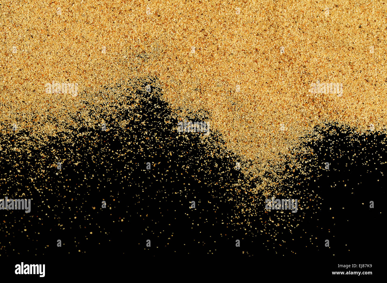 The sand on the black background Stock Photo - Alamy