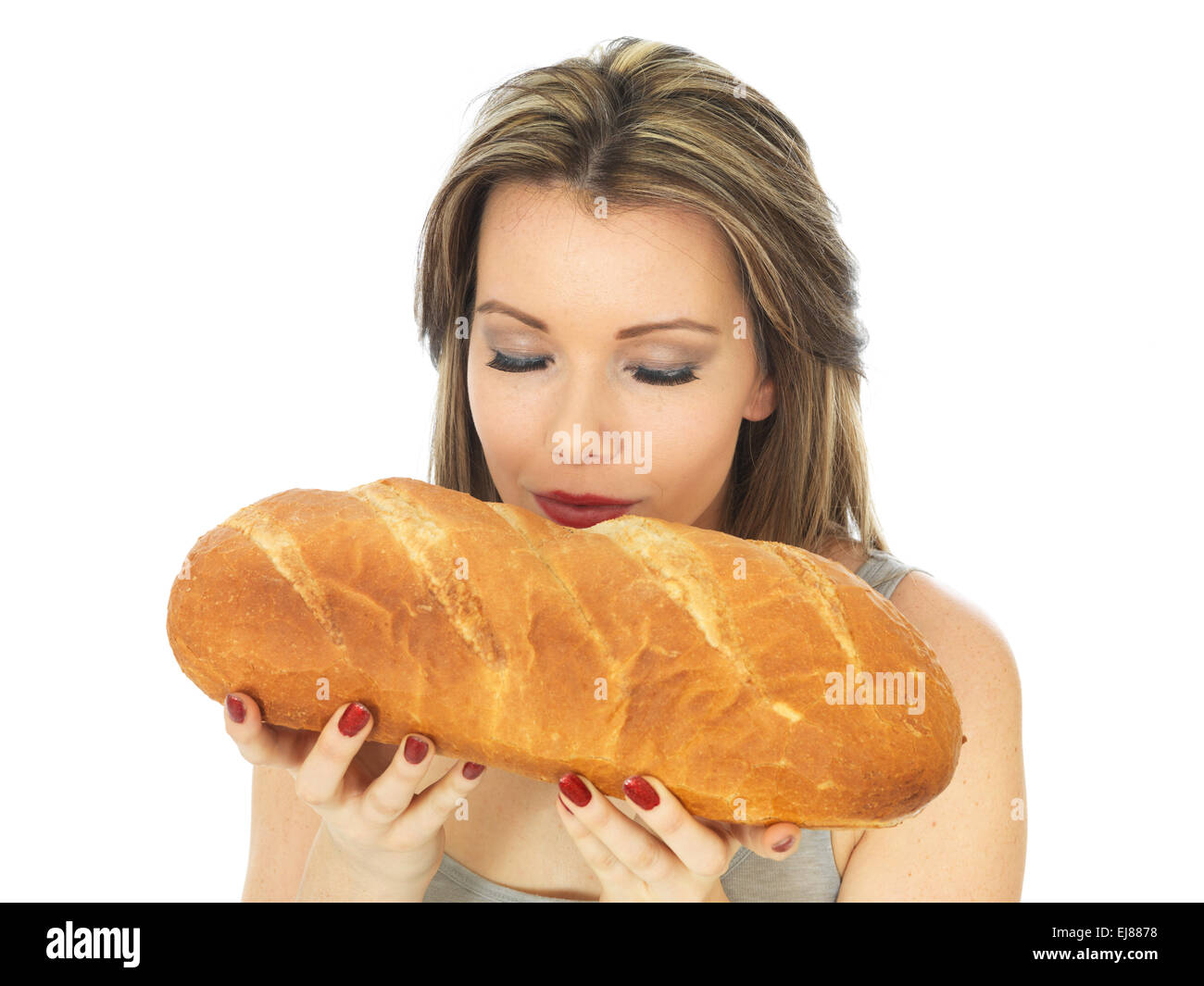 Attractive Young Woman Holding a Loaf of White Bread Stock Photo - Alamy