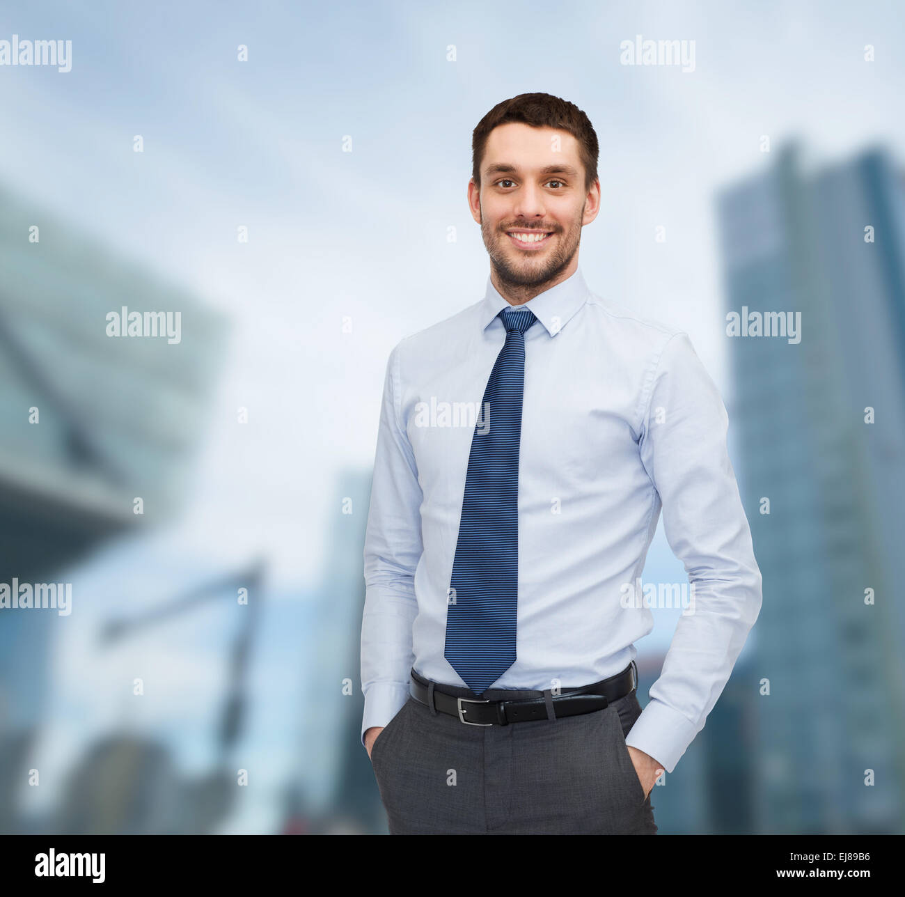 smiling young and handsome businessman Stock Photo - Alamy