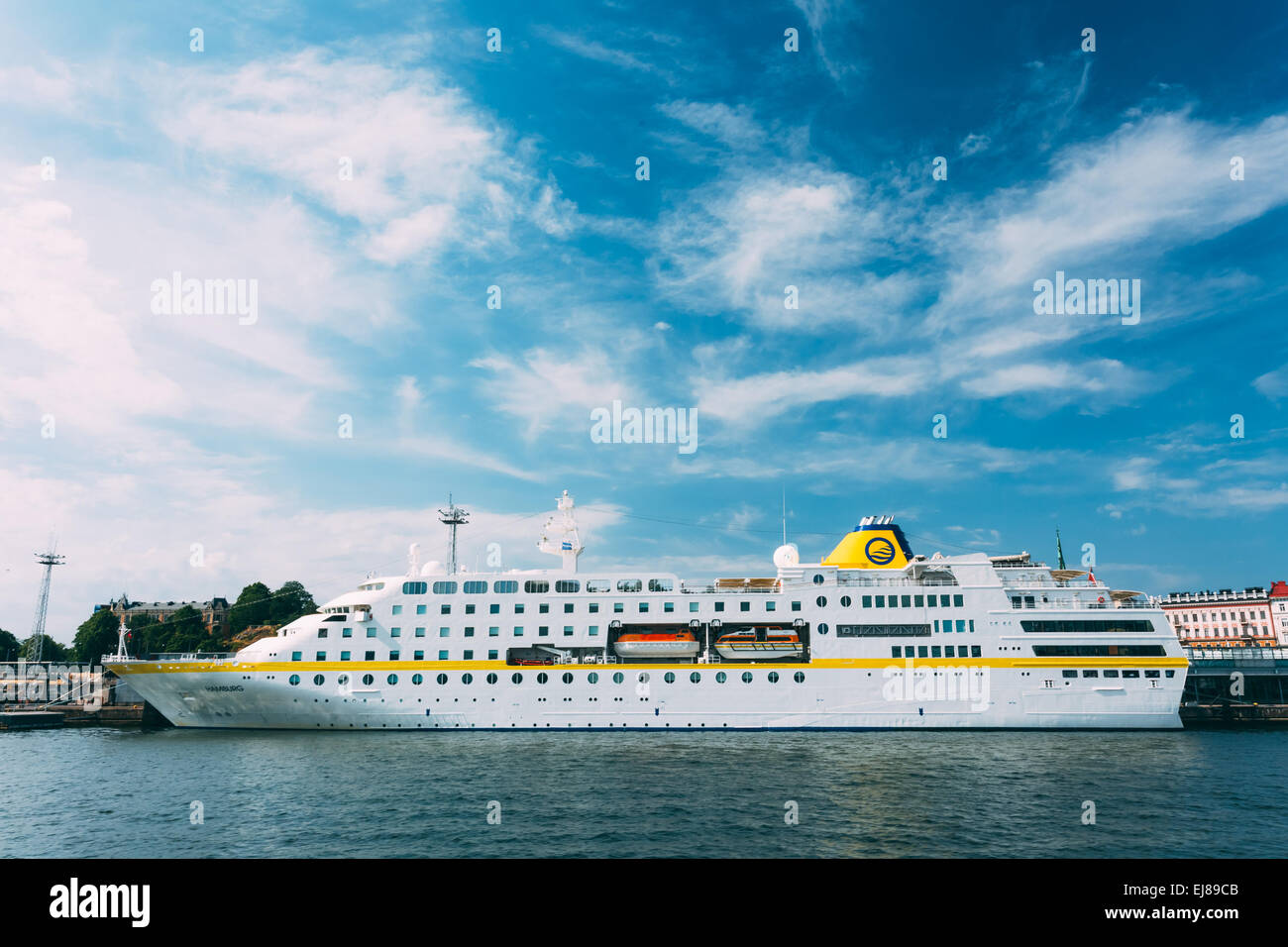 Modern passenger ferry boat stays in the seaport Stock Photo - Alamy
