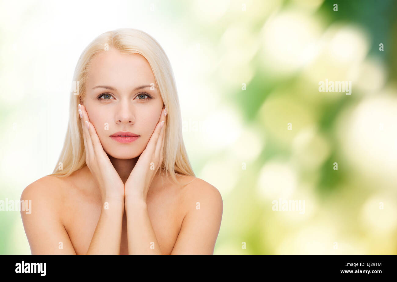 beautiful woman touching her face skin Stock Photo - Alamy