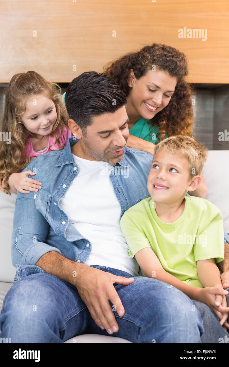 Happy family relaxing together Stock Photo - Alamy