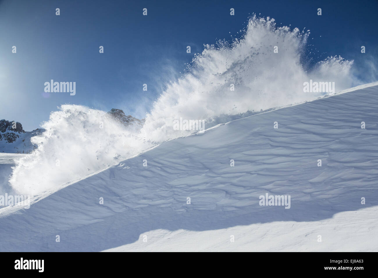 Snow explosion on mountains, freeze motion Stock Photo - Alamy