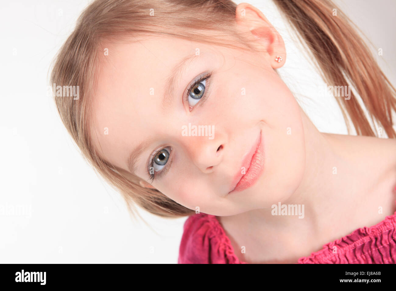 A beautiful girl child over a white background Stock Photo - Alamy