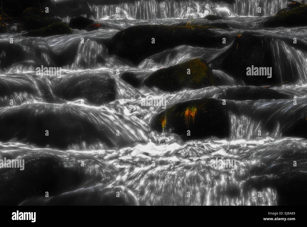 Flow between the rocks Stock Photo - Alamy