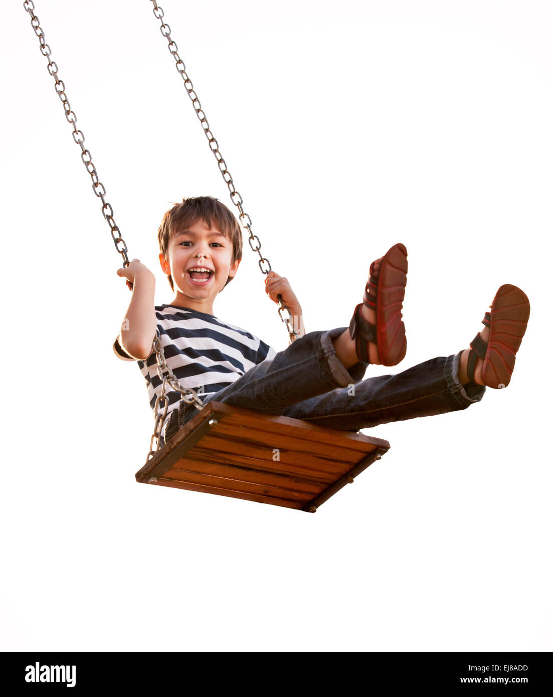 Cute boy playing on swing, having fun. On a white background Stock ...