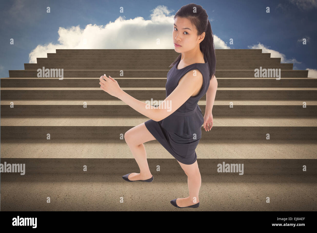Composite image of businesswoman stepping up Stock Photo - Alamy
