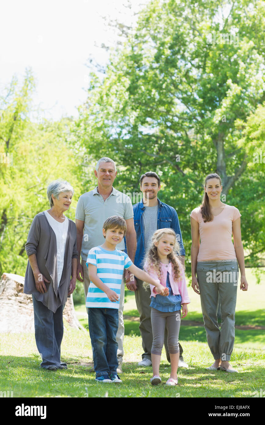 Happy extended family walking in park Stock Photo - Alamy
