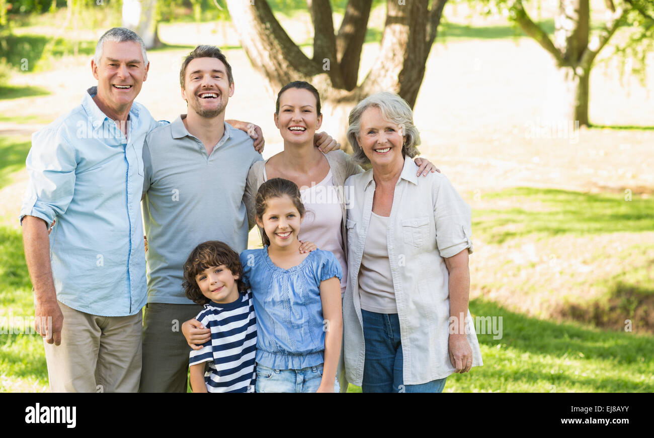 Portrait of a happy extended family in park Stock Photo - Alamy